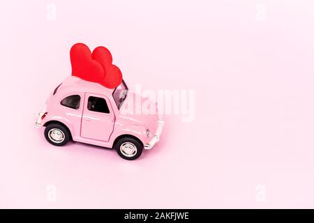 Miniature retro car delivering heart for Valentine's day Stock Photo ...