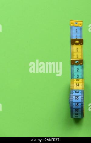 Tape measures of cyan, blue, yellow colors placed in pyramid Stock ...