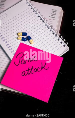 Writing Panic attack on memo post reminder. Text Panic attack on sticky ...
