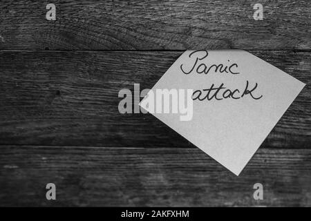 Writing Panic attack on memo post reminder. Text Panic attack on sticky ...