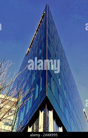 Contemporary triangular-shaped glass office building, located in ...