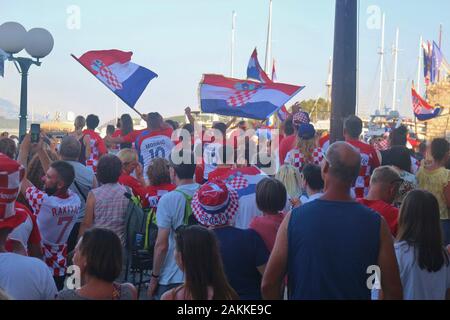 Soccer fans watch a live broadcast of the World Cup Group G match ...