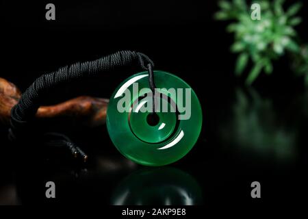 Round jade pendant features Stock Photo - Alamy