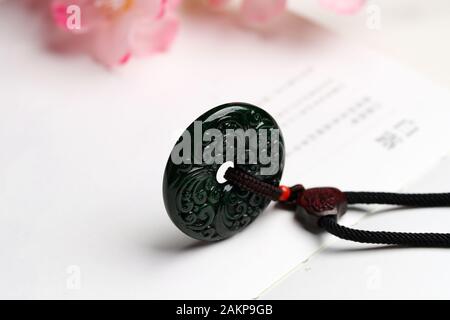 Round jade pendant features Stock Photo - Alamy