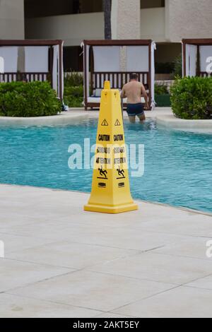 caution, slippery surface warning sign Stock Photo - Alamy