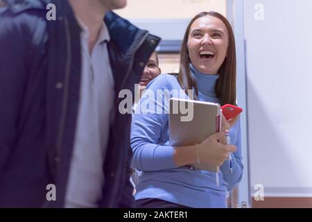 Students going out of classroom after lesson Stock Photo - Alamy