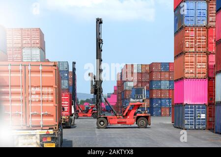 Container handlers Loading containers into trucks Stock Photo - Alamy