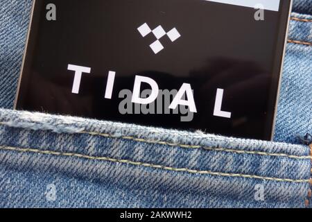 Tidal logo is displayed on smartphone. Tidal is a Norwegian-American ...