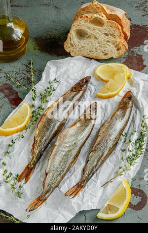Dried smoked capelin on a plate Stock Photo - Alamy