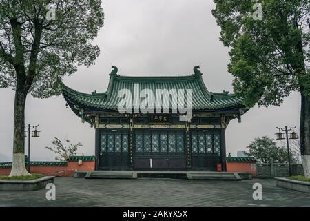 Ancient Hong'en Pagoda tower with green tiled red columns in Chongqing ...