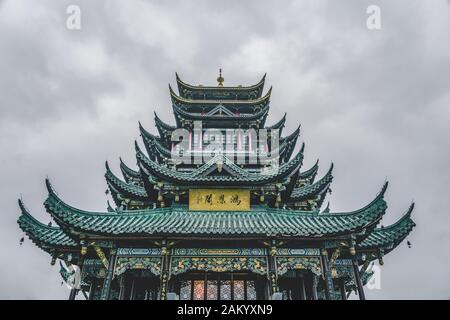 Ancient Hong'En Temple pagoda tower with green tile under overcast ...