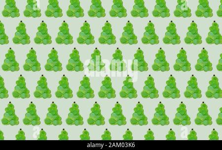 Christmas tree made of green confetti with santa hat on top against ...