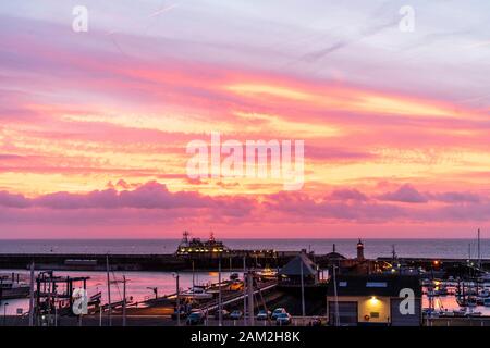 England, Ramsgate. Sunrise and dawn sky over the Thanet offshore wind ...