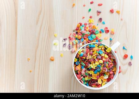 Kids healthy quick breakfast. Colorful rice cereal, milk and red apple ...