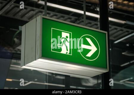 Emergency exit sign at airport, Terminal 5, Heathrow airport, London ...
