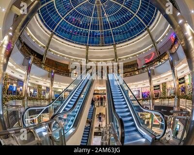 Interior of Canary Wharf Shopping Centre. Glass dome and the skyscraper ...
