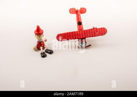 Airplane, Bullet and wooden pinocchio with his long nose Stock Photo ...