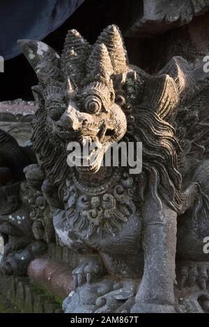 Balinese Hindu temple carving portraits depicting temple gaurdians and ...