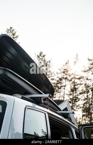 Car with the roof rack with cargo box. Black rooftop or roof carrier ...