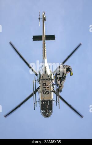 A North Carolina Helicopter Aquatic Rescue Team (NCHART) technician ...