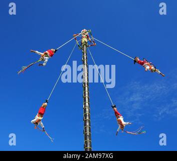 Mayan performers hanging turning around pole Riviera Maya Mexico Stock ...