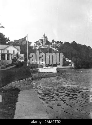 A historic image from the 1920s, showing a postman delivering mail in a ...