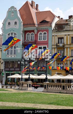 Union Square in Timisoara decorated festive with Romanian flags blown ...