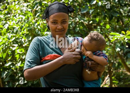 Portrait Of A Young Ethiopian Mother Breastfeeding Her Baby, Alaba ...