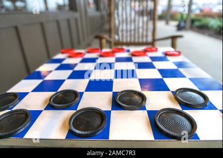 Red and Black Checkers Game Pieces Isolated on White Background Stock ...