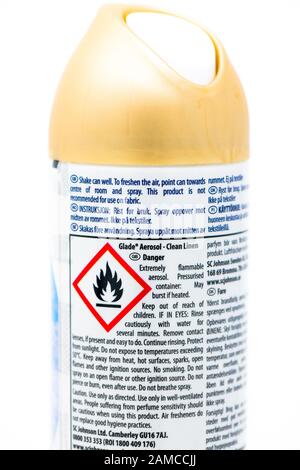 warning label on spray can showing "Extremely Flammable" and a fire ...