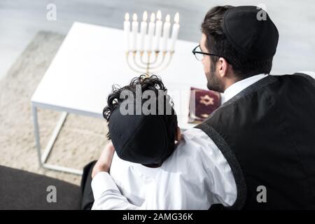 overhead view of jewish father hugging son in apartment Stock Photo - Alamy