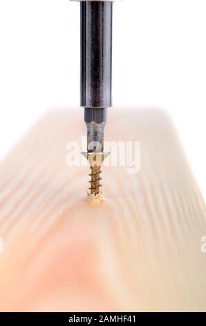 Wood Screw being screwed into a wood , Carpenter woodwork, screwing ...