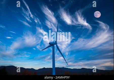 Moonrise over a lone wind turbine in Dexter Minnesota USA Stock Photo ...