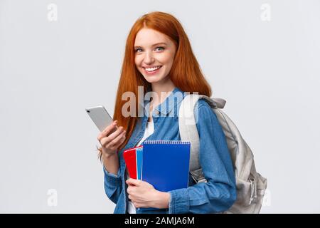 Friendly redhead student young girl wearing school uniform and Stock ...