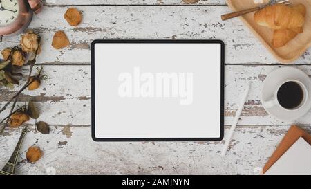 Overhead shot of cozy workplace with breakfast and office supplies on ...