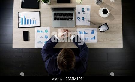 Businessman closing laptop finishing work in office Stock Photo - Alamy