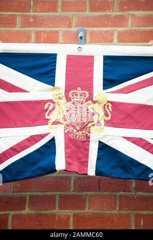 Union Jack flag with the Royal Coat of Arms of Queen Elizabeth II Stock ...