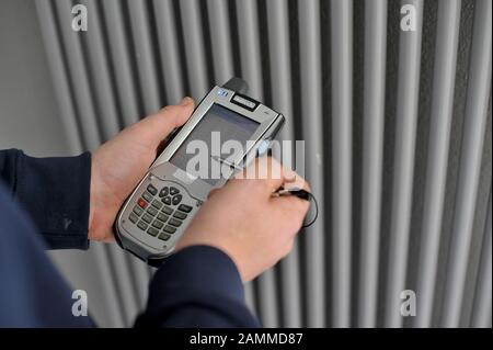 A heating meter reader from the Ista company at work. [automated ...