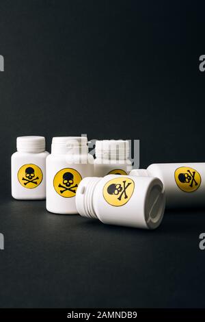 Bottles of poison with warning sign isolated on white Stock Photo - Alamy