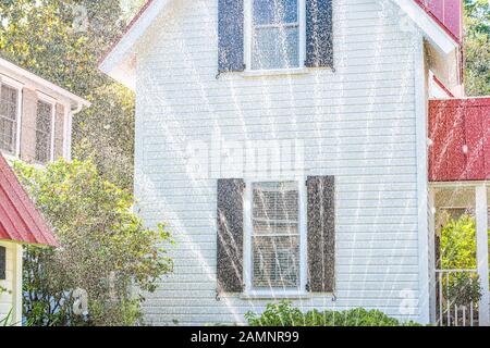 The sprinklers water the lawn of the White House, Sunday, May 31, 2026 ...