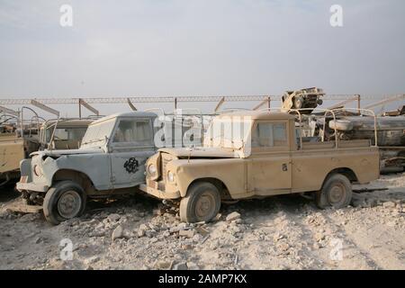 Land rovers on a scrap yard in the middle east Stock Photo - Alamy