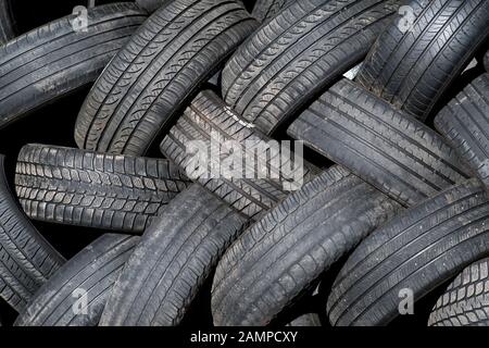 Old tires stacked together used at racing track Stock Photo - Alamy