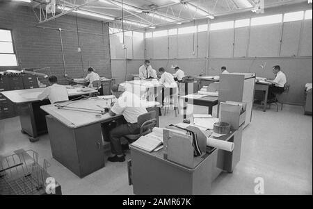 1980s, historical, male employees working at their desks in a technical ...