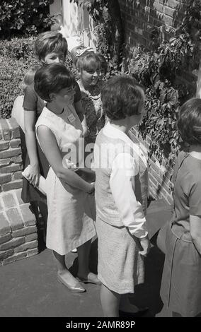 1964, historical, new female students, undergraduates, standing talking ...
