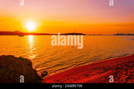 Sunrise or sunset with yacht at Porto Rotondo in Costa Smeralda at ...