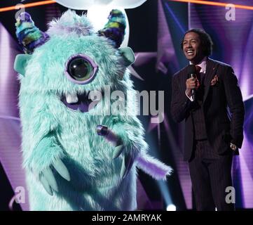 THE MASKED SINGER, from left: host Nick Cannon, Kirstie Alley (revealed ...