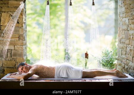 Man having a Vichy shower Stock Photo - Alamy