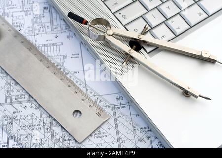 Laptop, rulers and pens on a floor map Stock Photo - Alamy