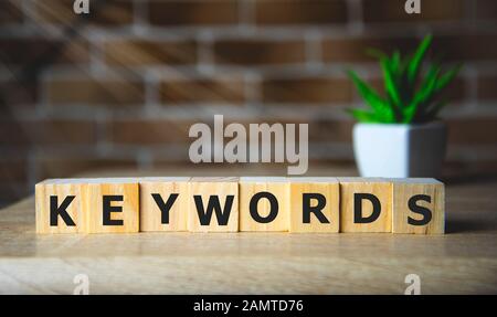 Conceptual business keywords on table with elements of game making ...