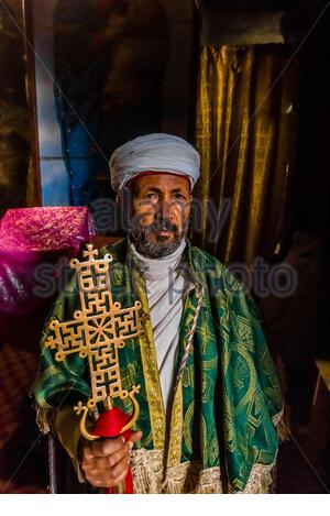 Ethiopian Orthodox Priest Holding A Cross During The Colorful Timkat ...